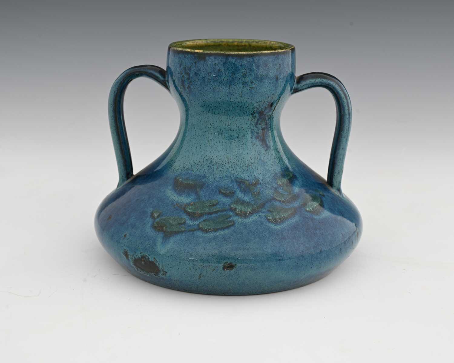 Lot 613 - Ruskin Pottery, a Souffle Glaze twin handled