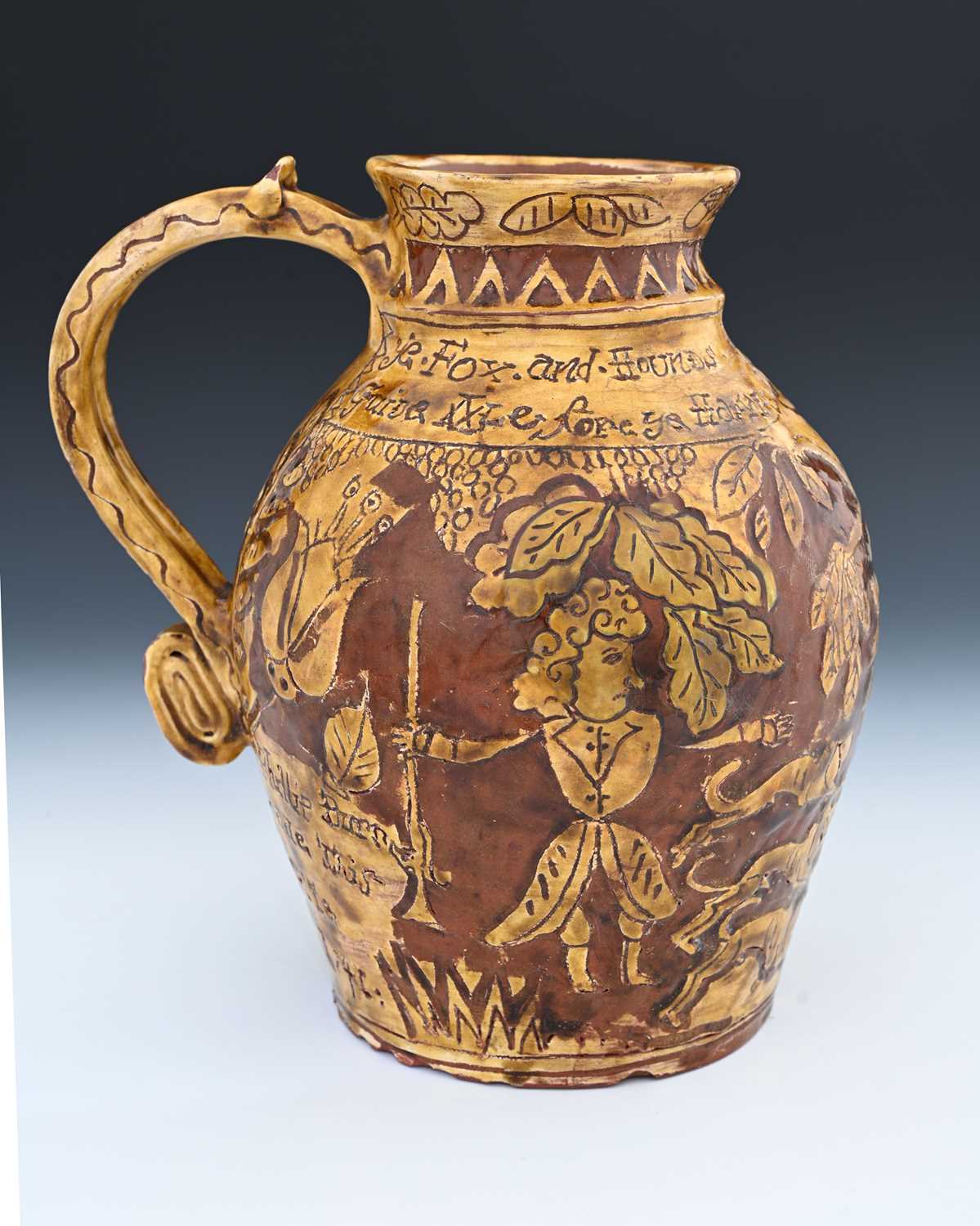 Lot 757 - An English slipware jug, sgraffito decorated
