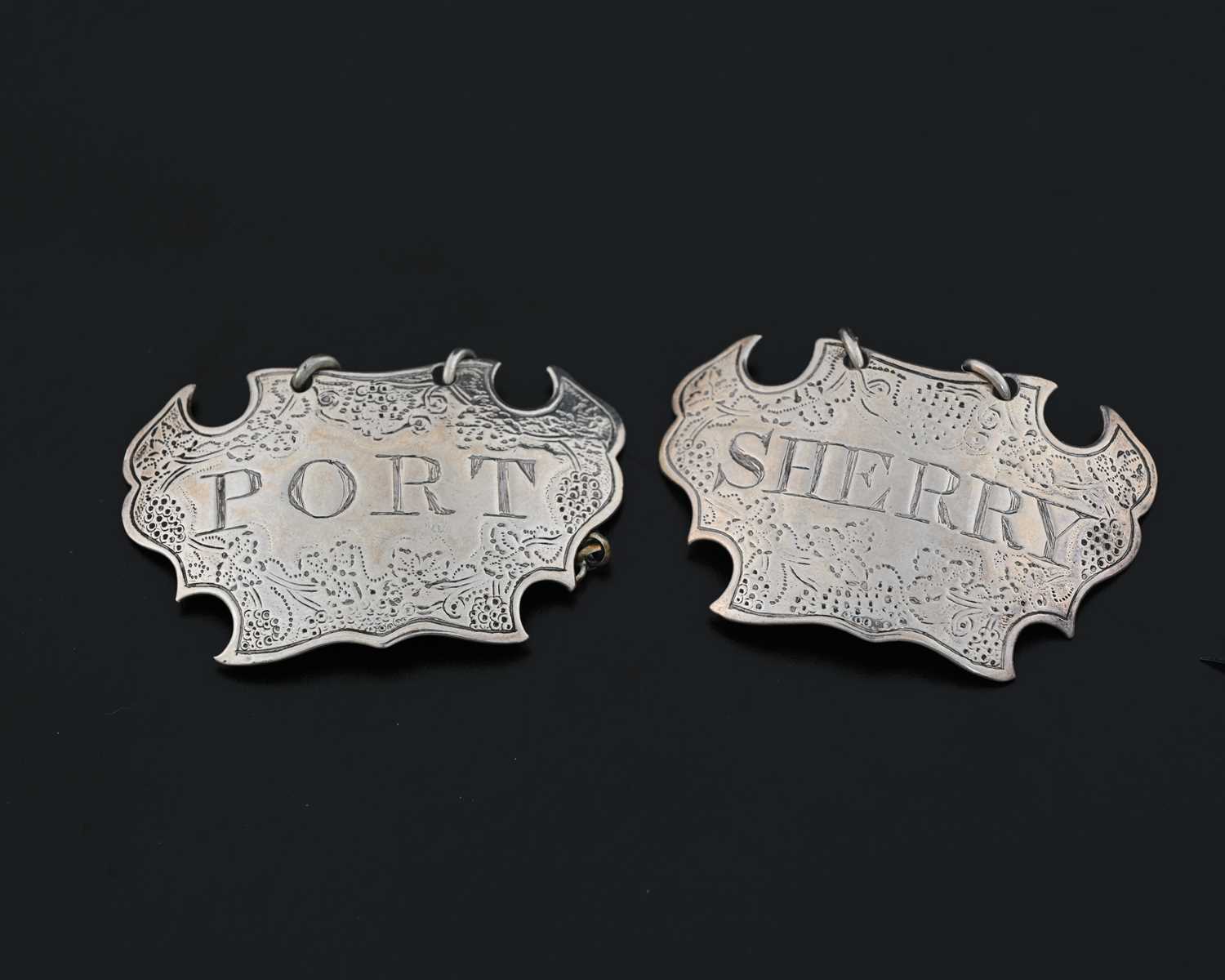 Lot 161 - A pair of George III silver wine labels or