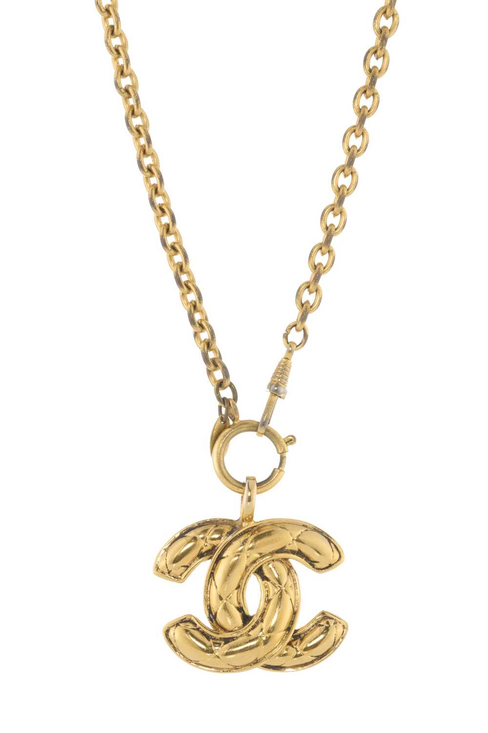 Lot 388 - Chanel, a vintage quilted CC pendant.