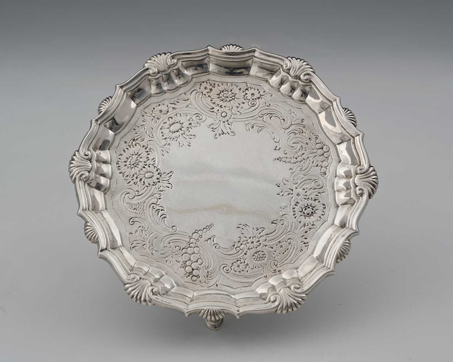 Lot 274 - A George II silver waiter, the border