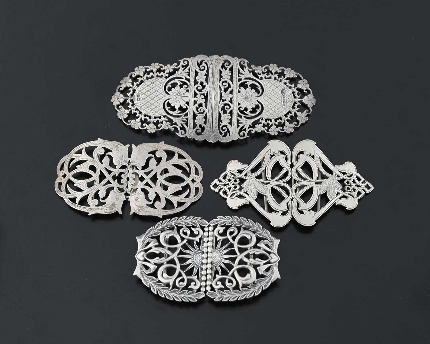 Lot 430 - Four silver buckles, one cast example by