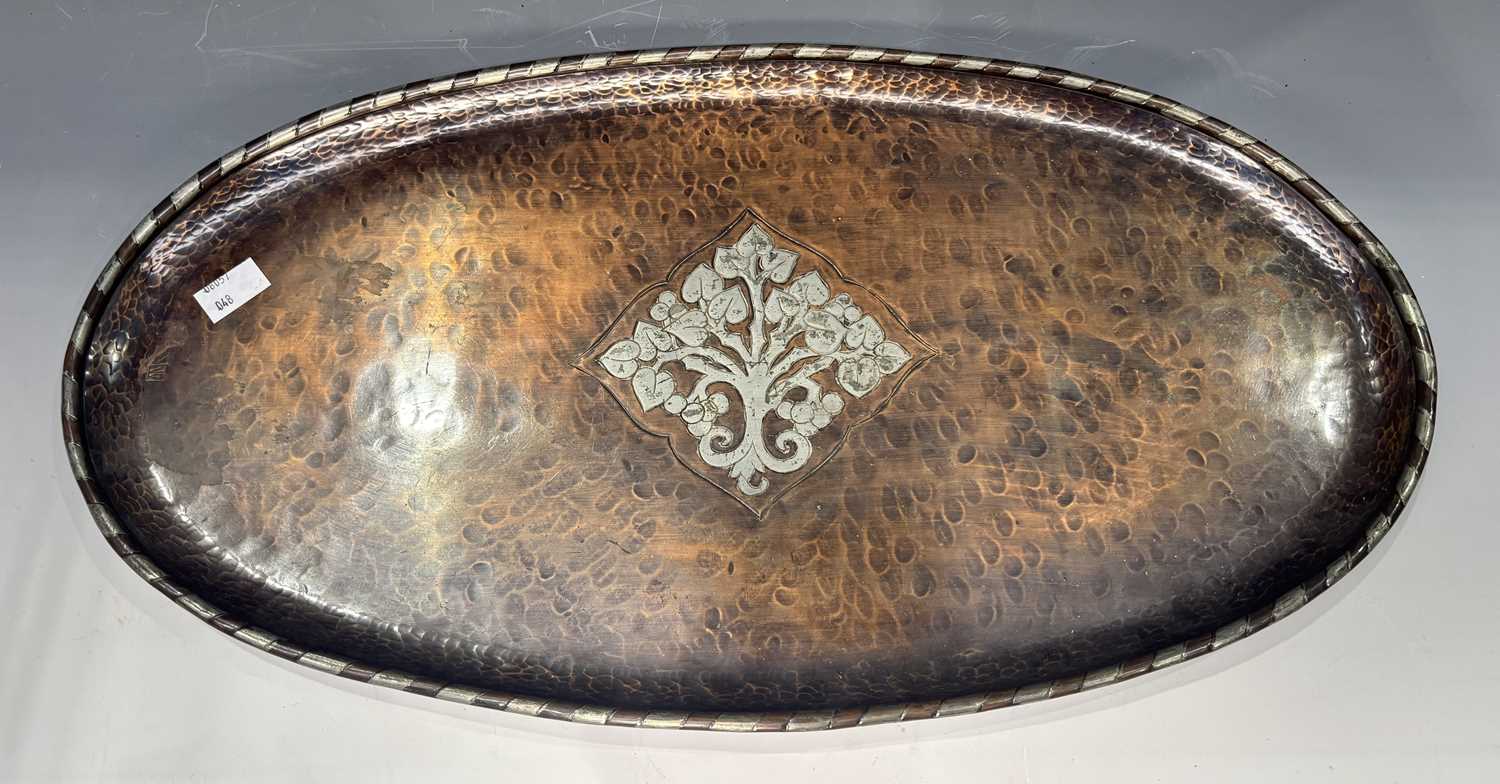 Lot 362 - A Hugh Wallis (1871-1943) oval beaten copper