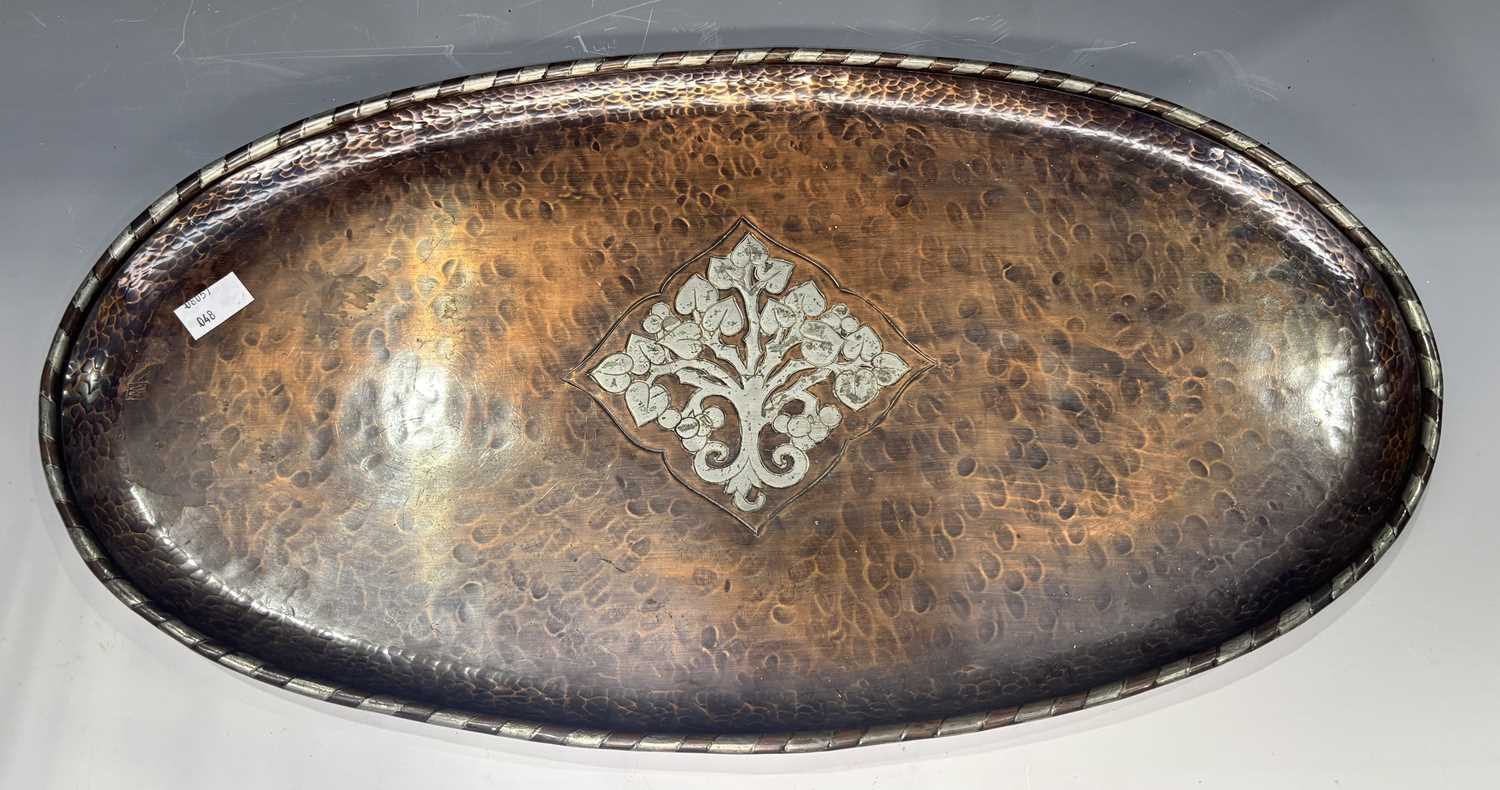 Lot 362 - A Hugh Wallis (1871-1943) oval beaten copper