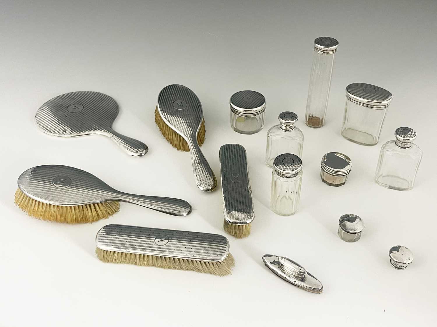 Lot 320 - A George V silver eleven-piece dressing